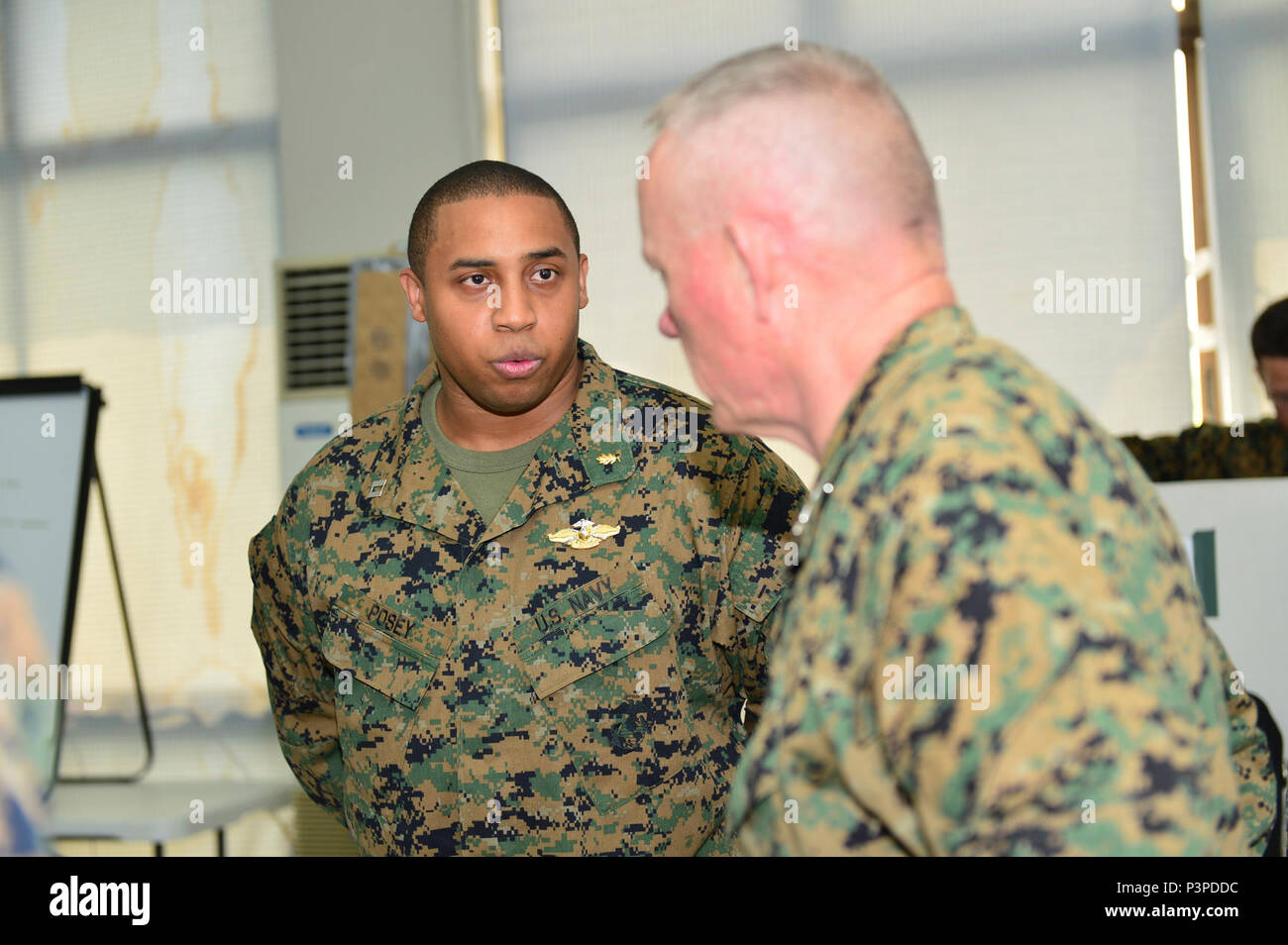 U.S. Marine Lt. Gen. Lawrence D. Nicholson talks to U.S. Navy Lt ...