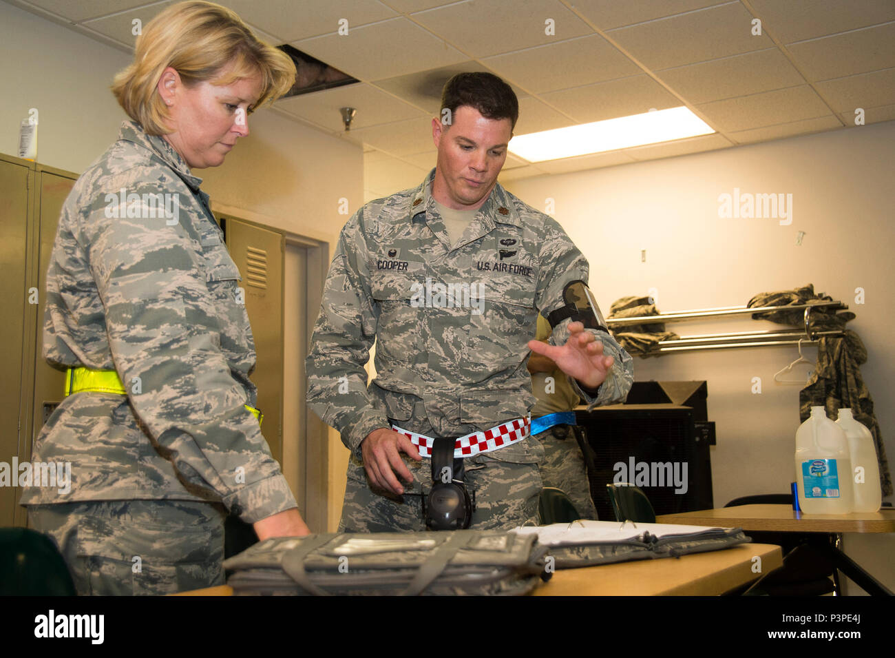 Col. DeAnna Burt, Air Expeditionary Wing commander, receives a briefing from Maj. Brian Cooper ...