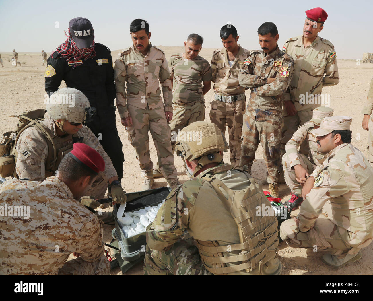 U.S. Marine Capt. Sebastian Calvo, left, demonstrates assembly of an ...