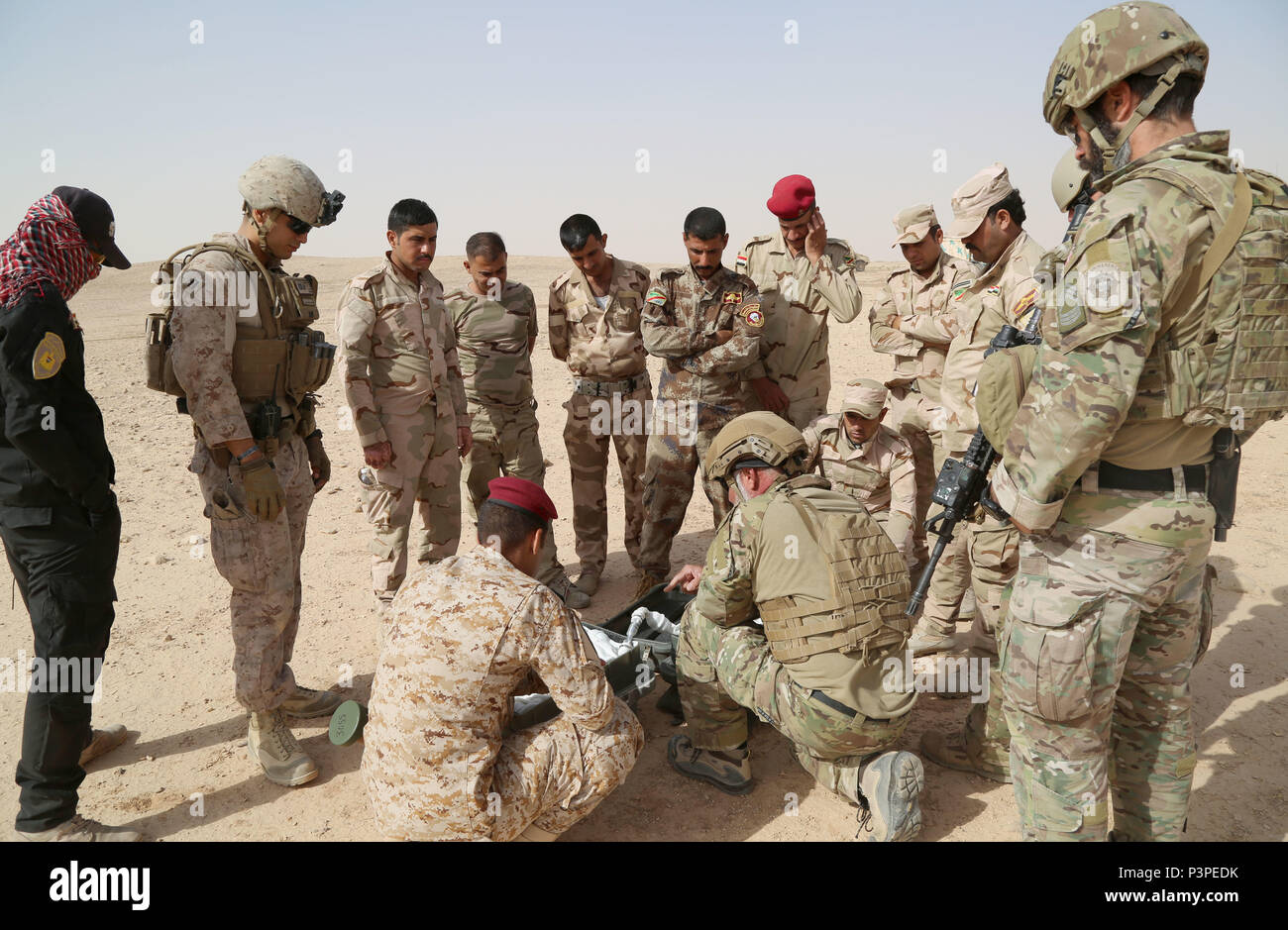 A trainer with Task Force Atlas demonstrates assembly of an anti ...