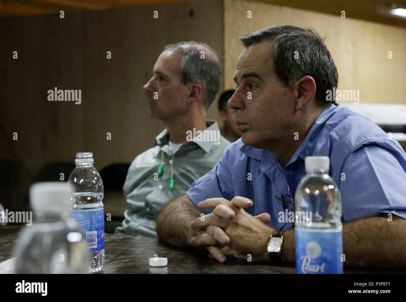 Stuart E. Jones, United States Ambassador to Iraq, listens to brief ...