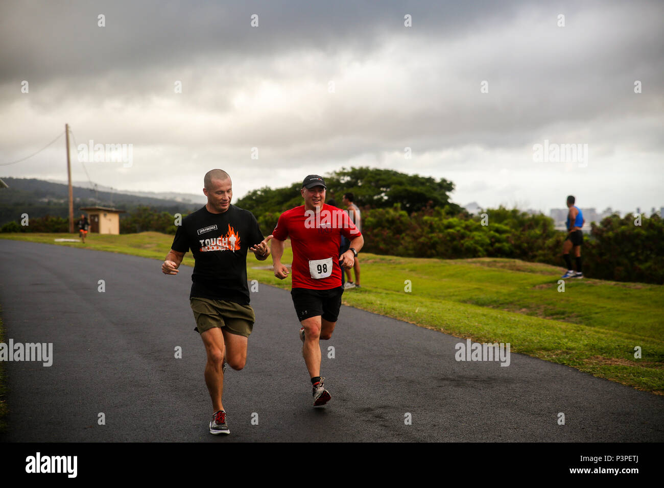 Sgt. Major Eric D. Cook, left, and Col. Peter Gadd approach the finish ...