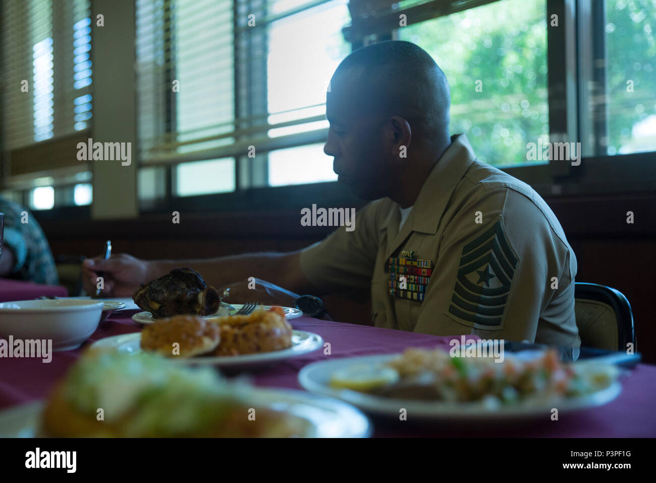 Sgt. Maj. Clement C. Pearson writes comments while serving as a judge ...