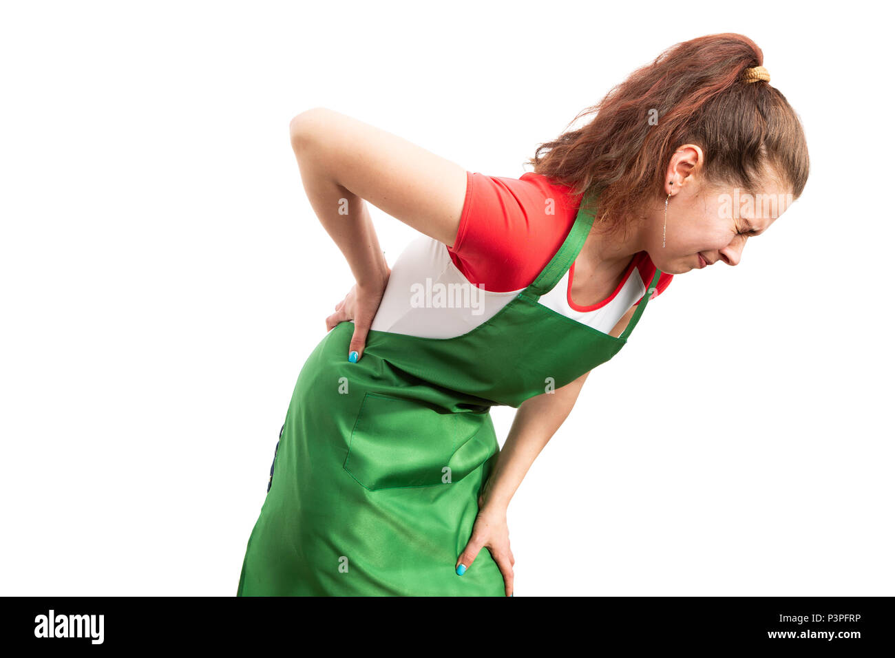 Young woman retail sales worker or storekeeper suffering backache and ...