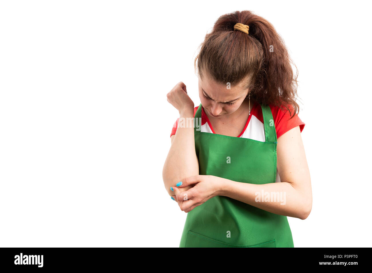 Young woman supermarket or retail worker suffering elbow pain as ...