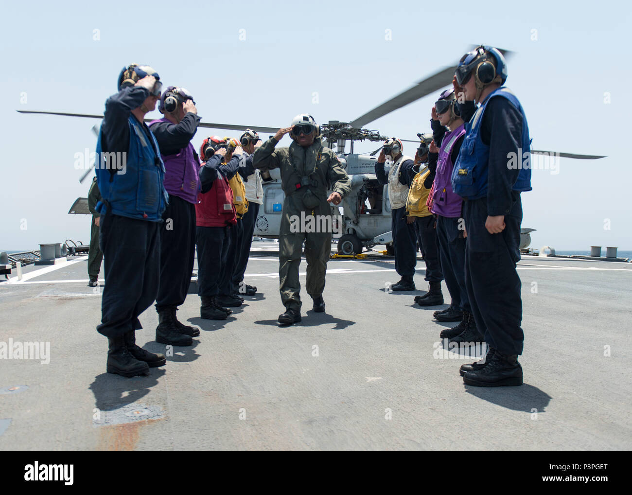Sailors aboard the guided-missile destroyer USS Stout (DDG 55), an ...