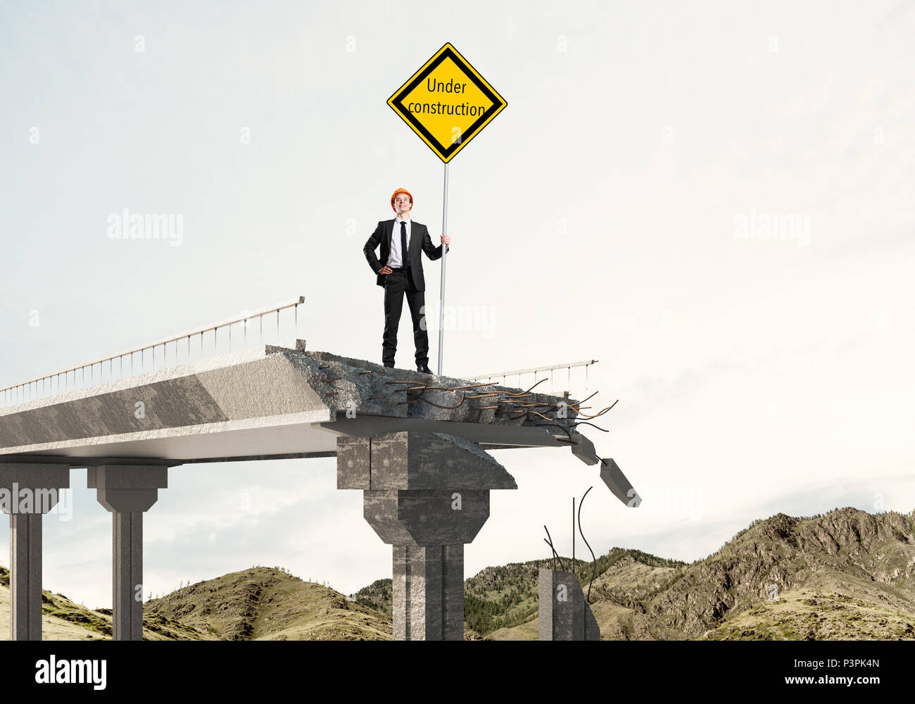 Confident engineer holding street safety sign Stock Photo - Alamy