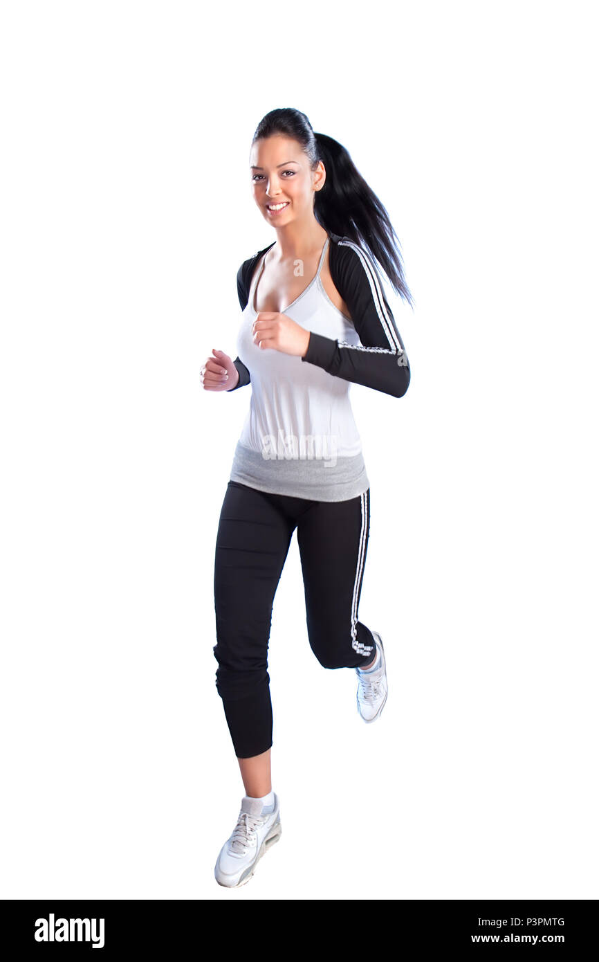 Beautiful woman running,studio shot Stock Photo - Alamy