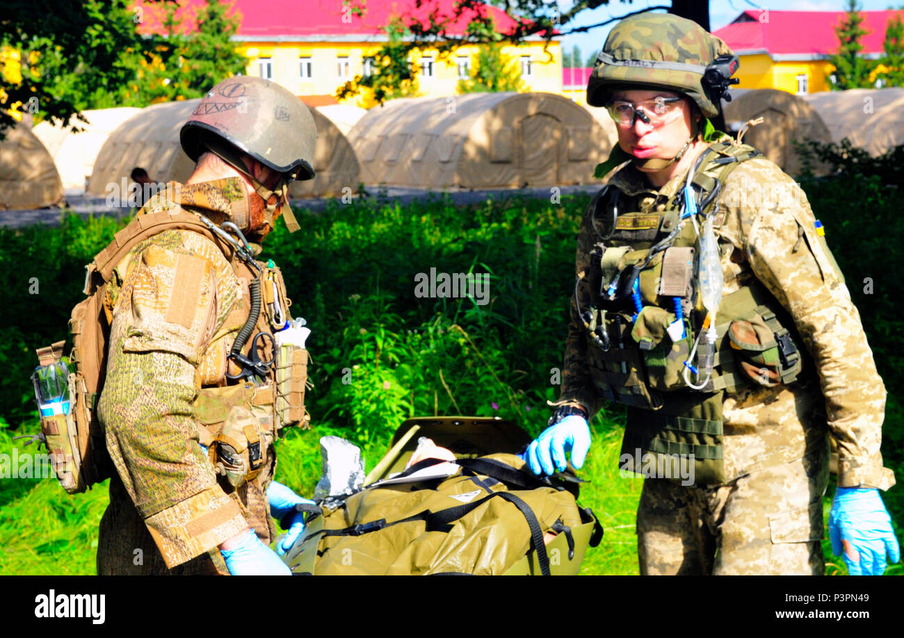 YAVORIV, Ukraine--A Ukrainian medic breathes a sigh of relief at the ...
