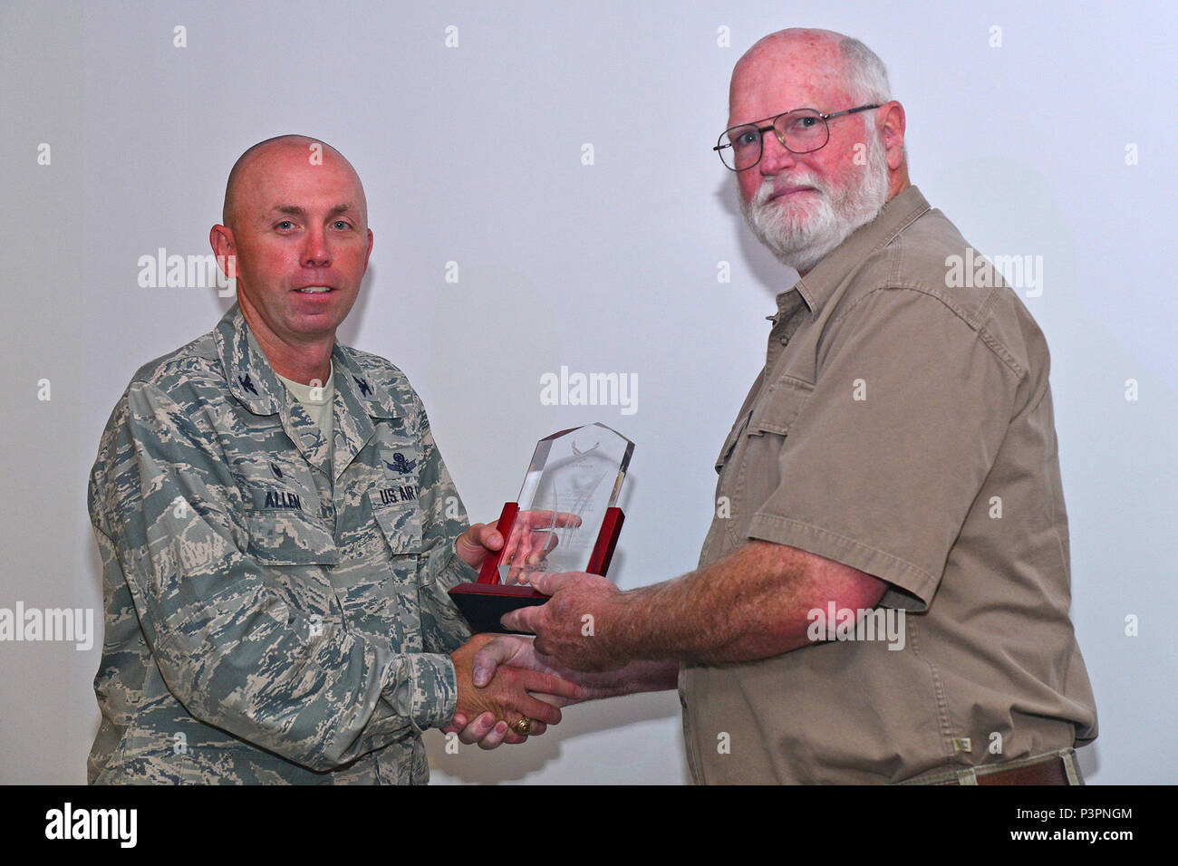 Col. Ron Allen, 341st Missile Wing commander, presents David Phillips ...