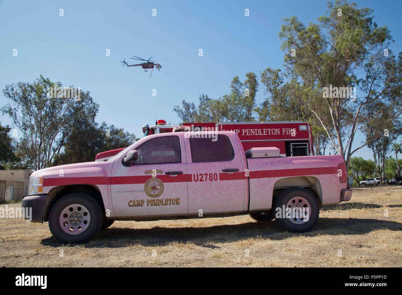 Helicopters fill up with water from Lake O’Neill to assist Camp ...