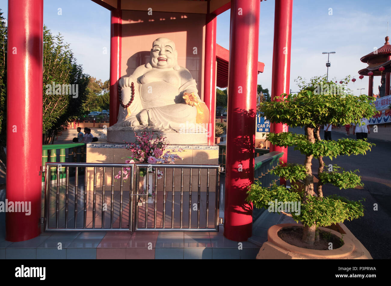 A smiling buddha statue at a buddhish temple Stock Photo - Alamy