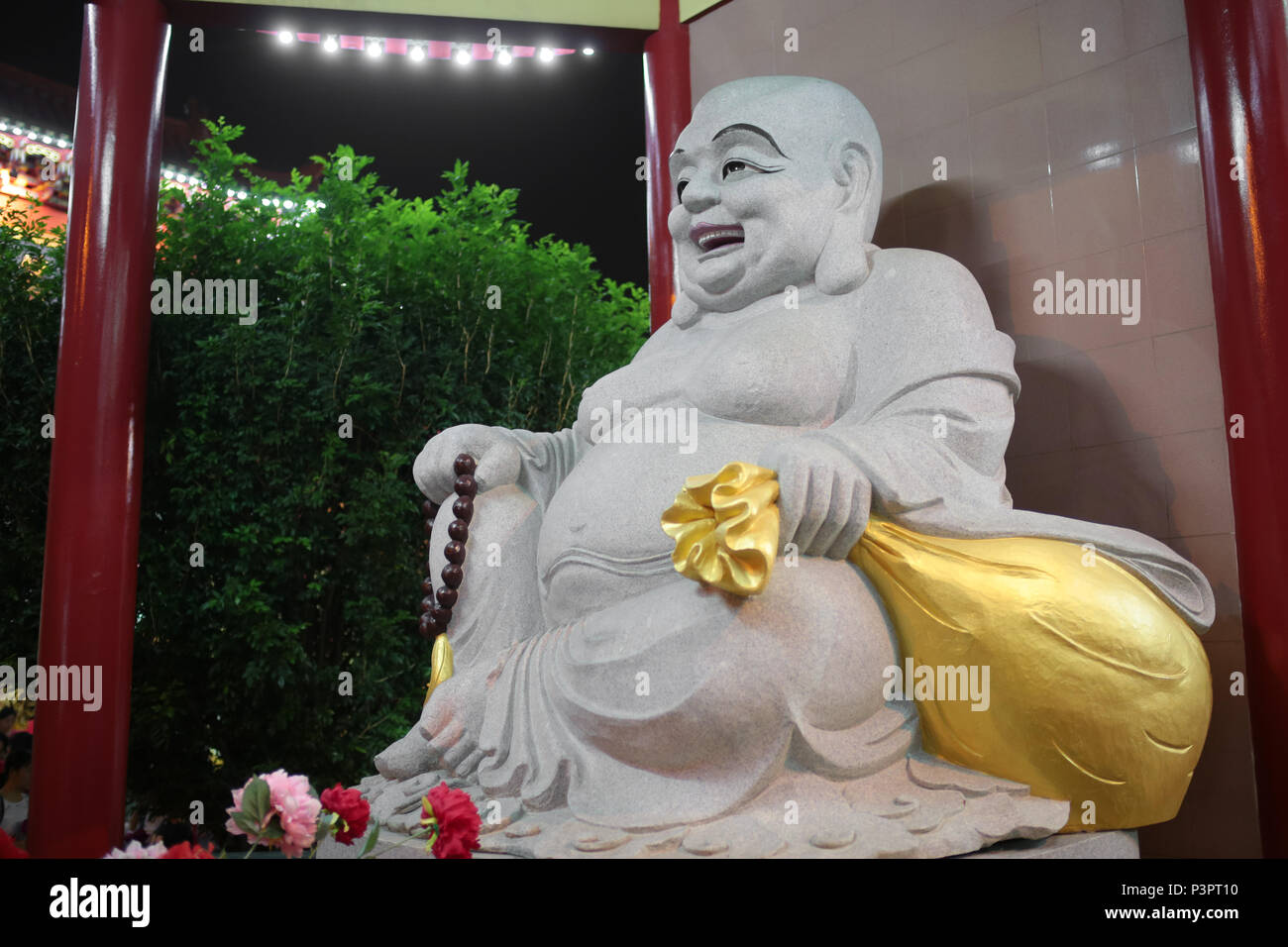 A smiling buddha statue at a buddhish temple Stock Photo - Alamy