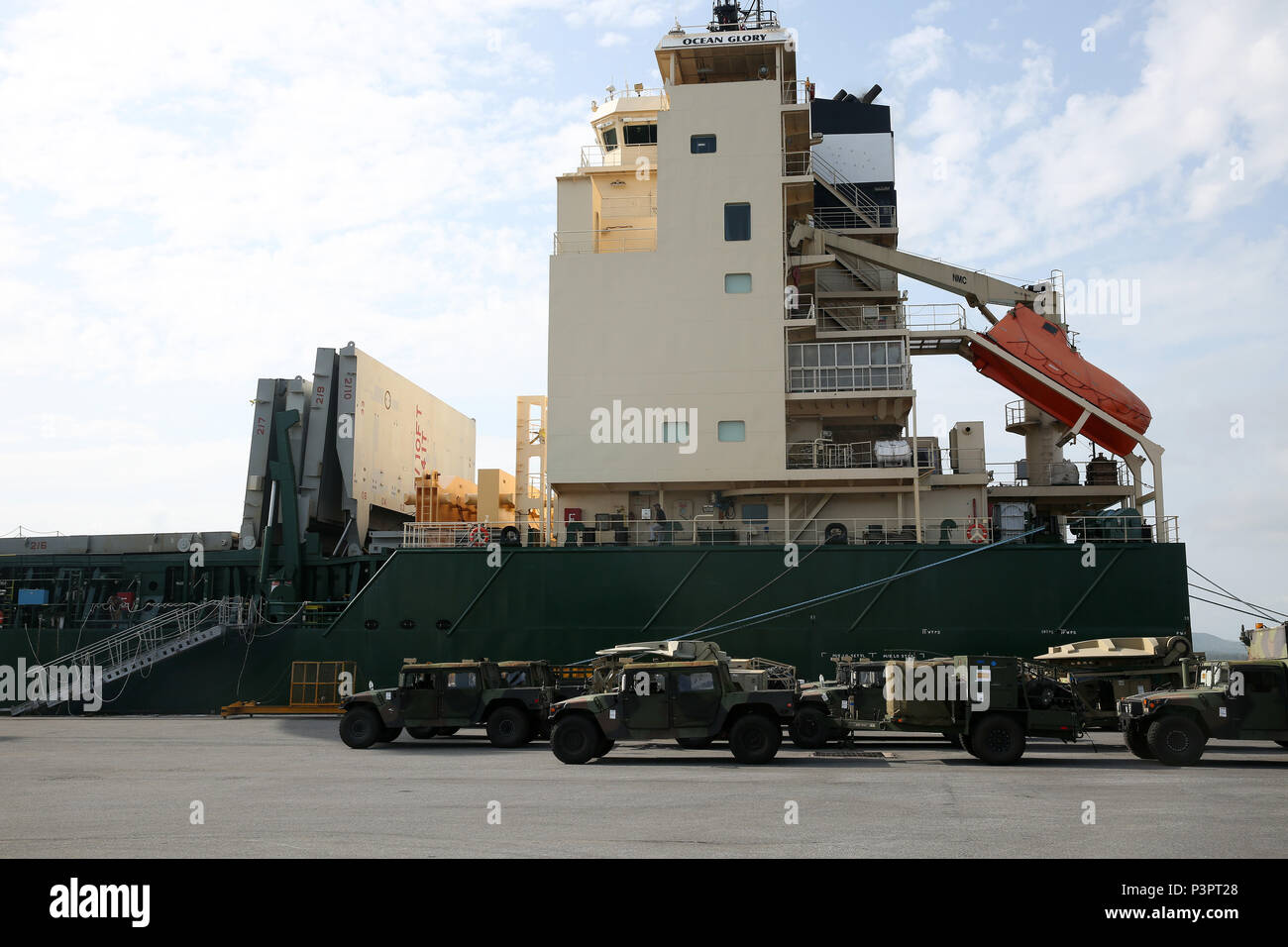 160712-N-IX266-027 SATTAHIP, Thailand—A group of military vehicles is ...