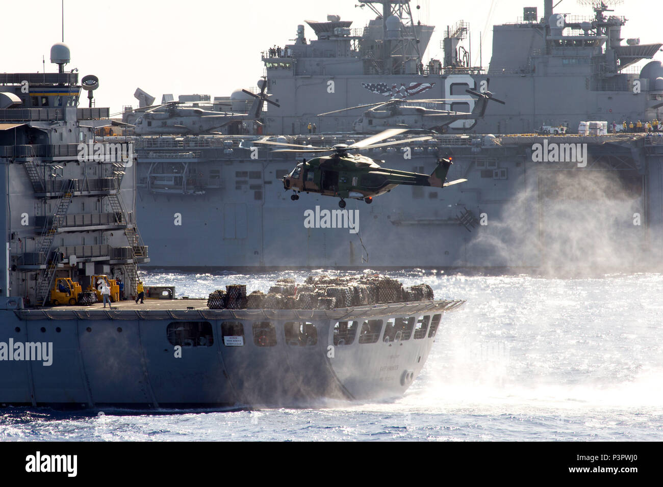 Amphibious assault ship USS America provides an impressive backdrop as ...