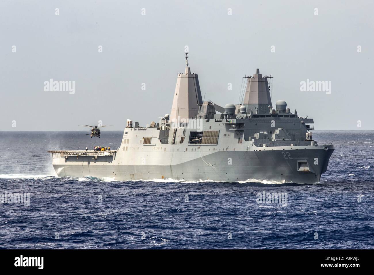 HMAS Canberra's embarked MRH-90 helicopter conducts a vertical ...