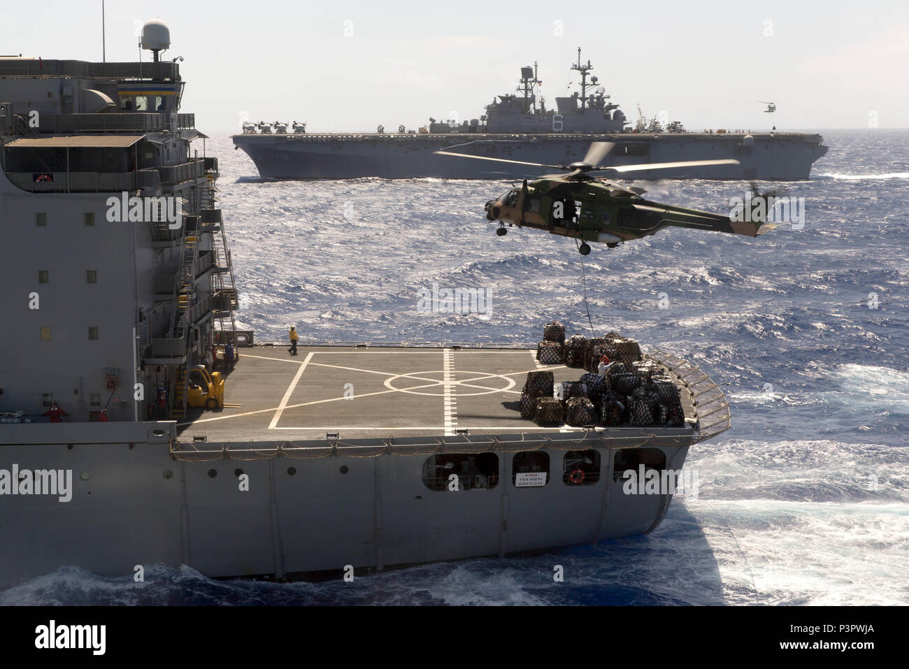 Amphibious assault ship USS America provides an impressive backdrop as ...
