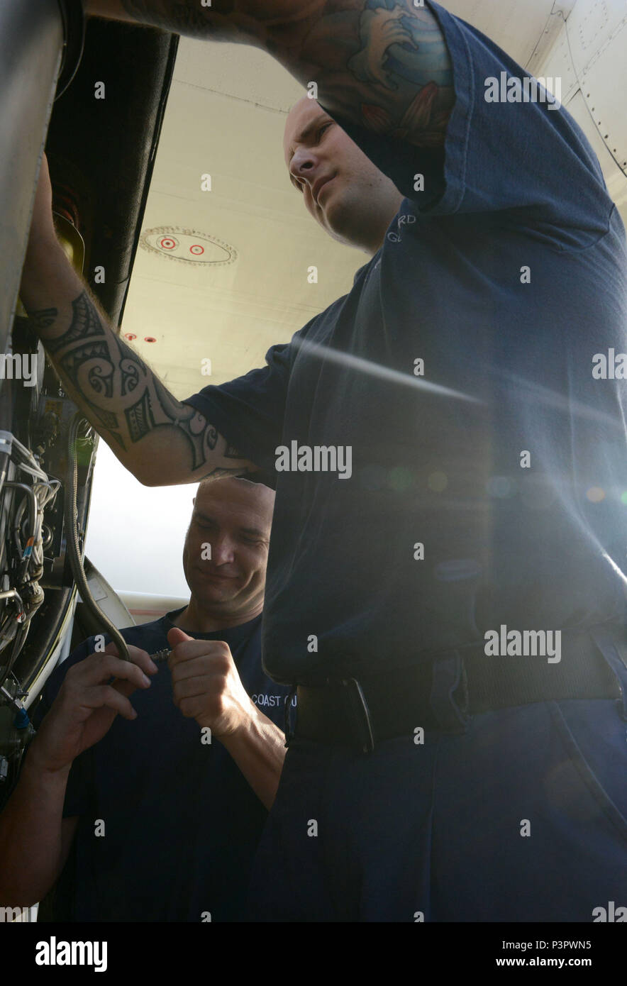 Petty Officer 2nd Class Michael Harman and Petty Officer 2nd Class Mike Saylor, aviation ...