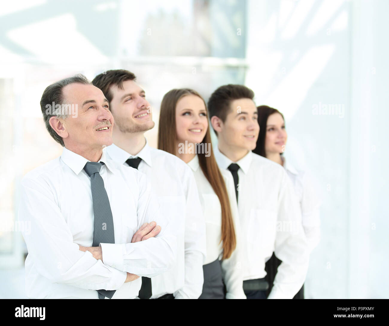 successful business team looking at copy space Stock Photo - Alamy