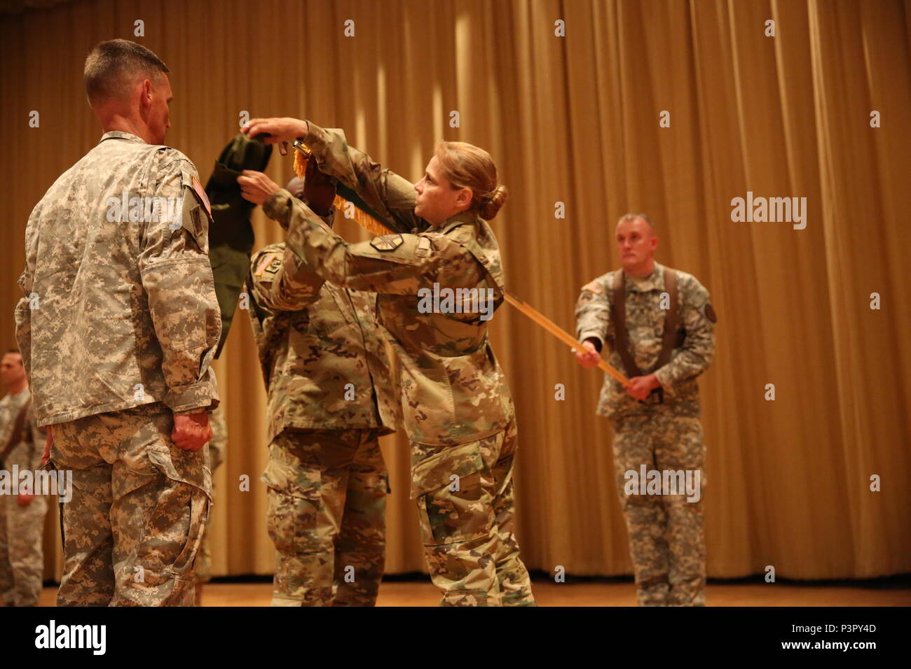 Col. Walter Catlett, left, commander, 2nd Mobilization Support Group, watches as Lt. Col ...
