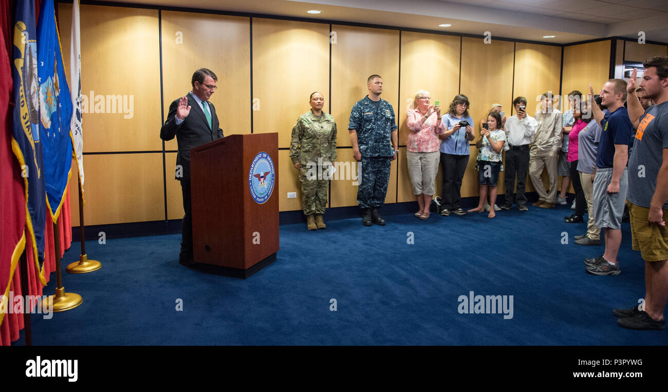 Secretary of Defense Ash Carter perform an oath of enlistment ceremony ...