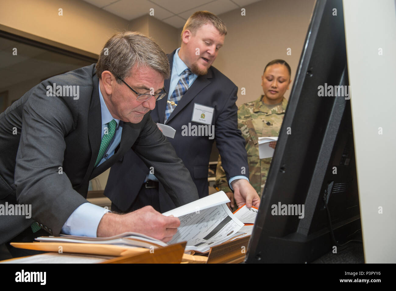 Secretary of Defense Ash Carter meets with workers during a visit to ...