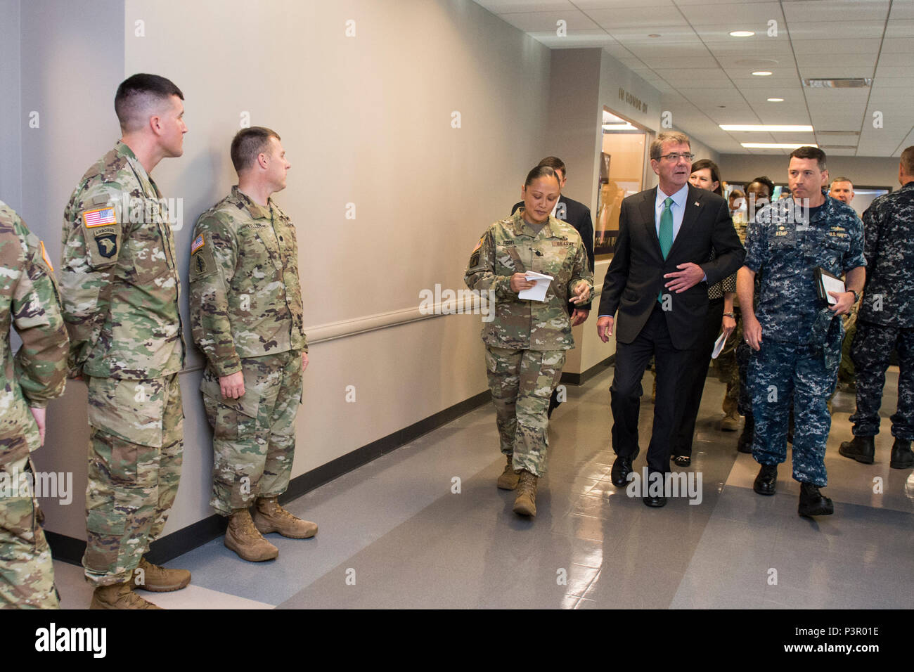 Secretary of Defense Ash Carter meets with workers during a visit to ...