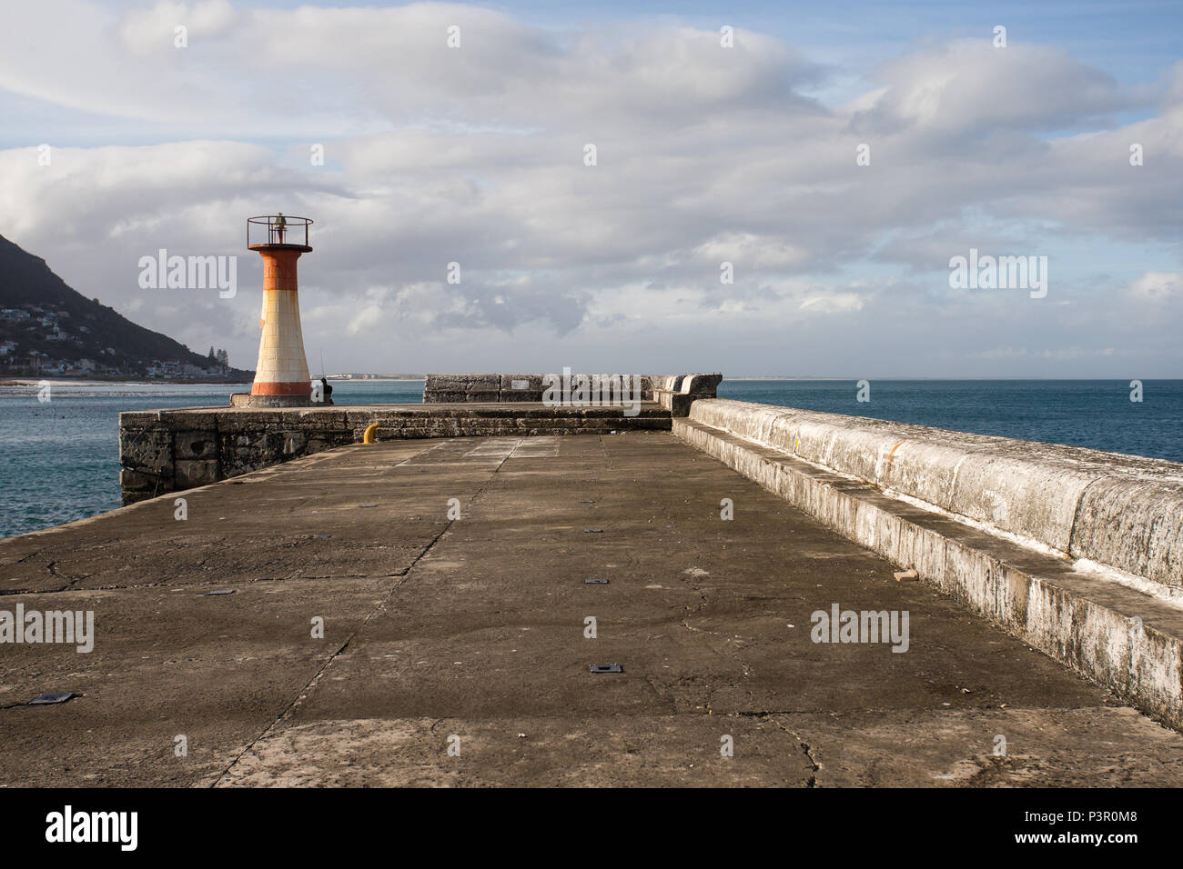 port light beacon, red and white, on harbour or sea wall in Kalk Bay ...