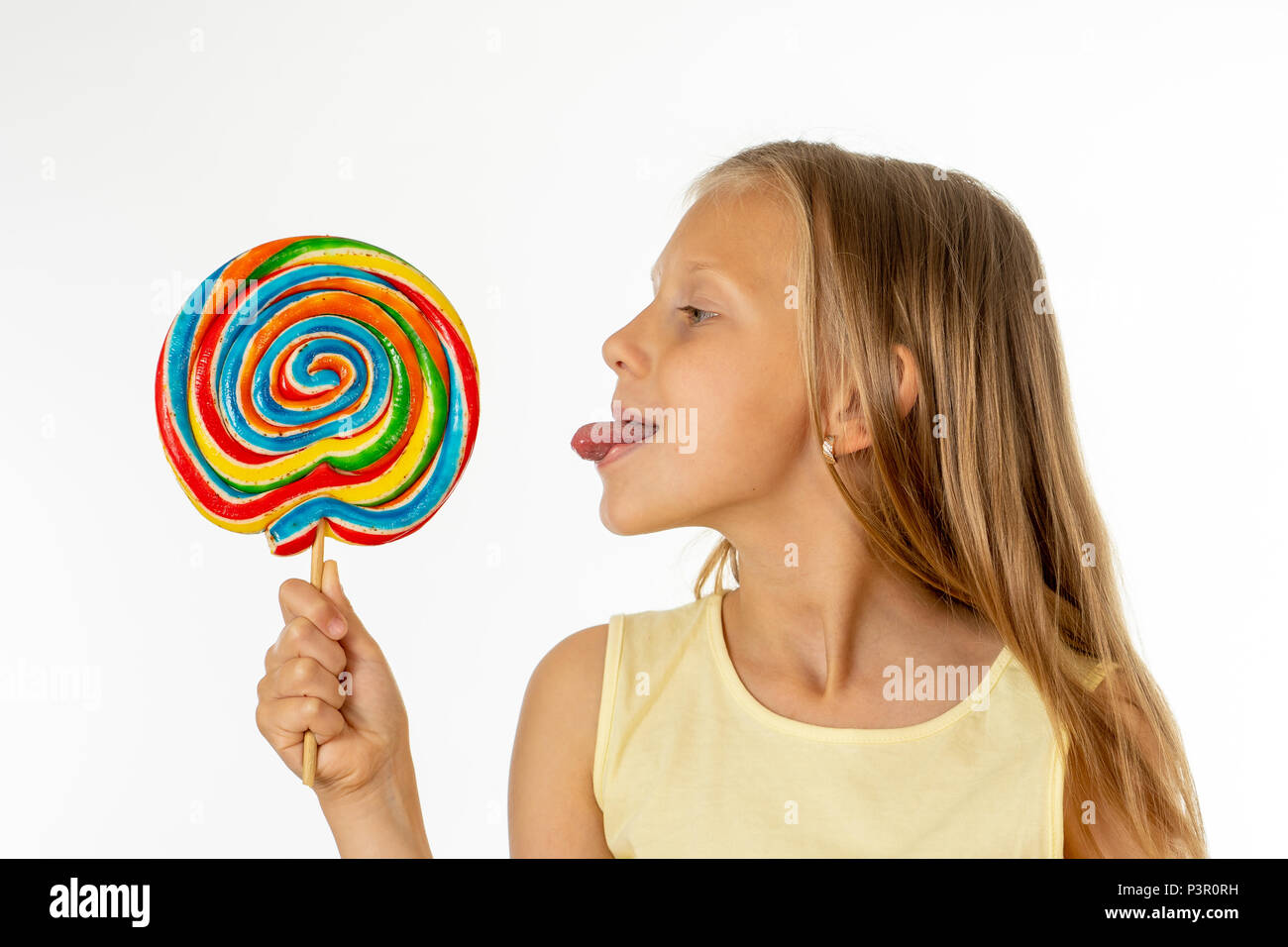 cute happy child with candy lollipop, happy girl eating big sugar ...