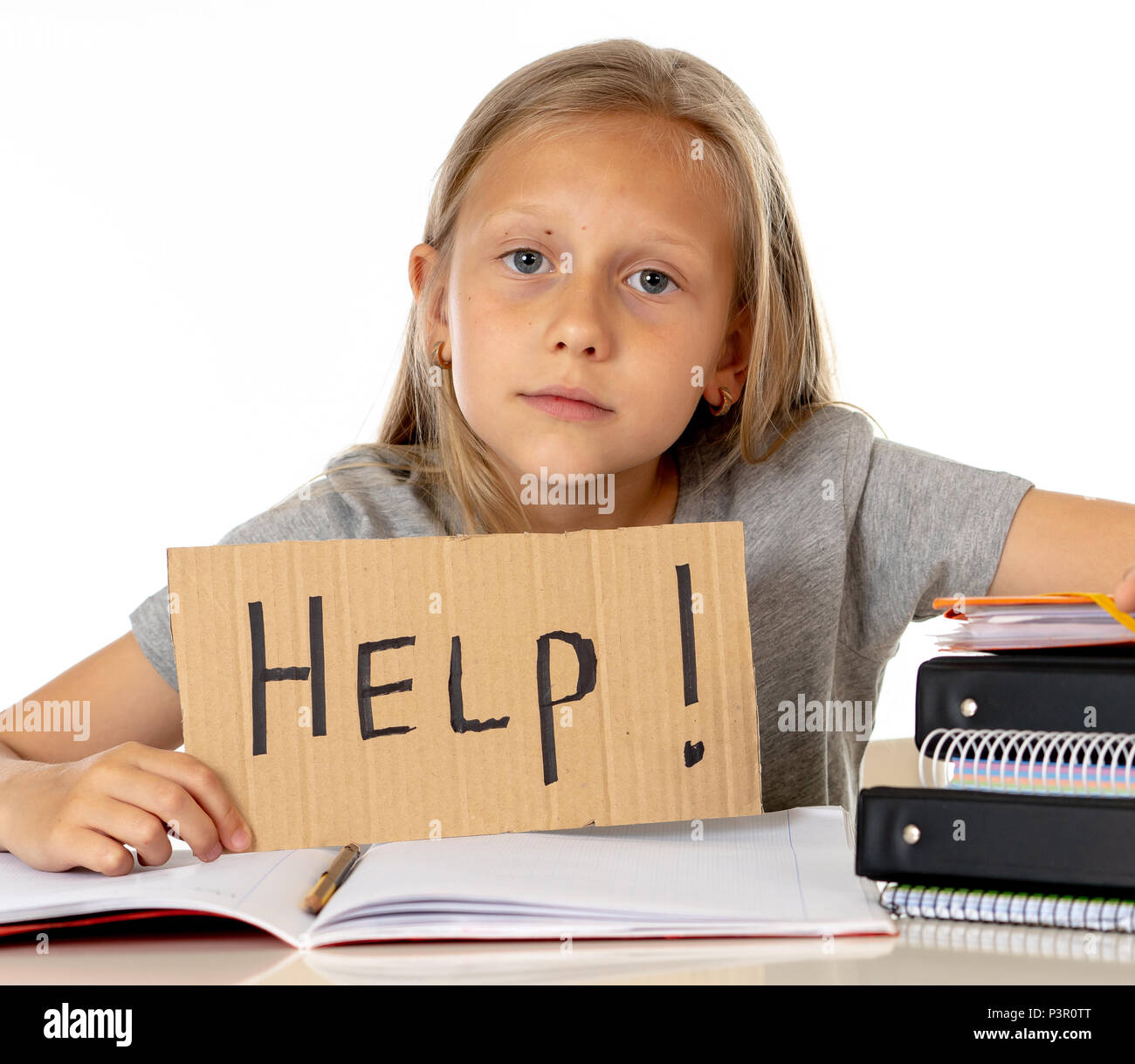 sweet cute little blonde hair school girl holding help sign in stress ...