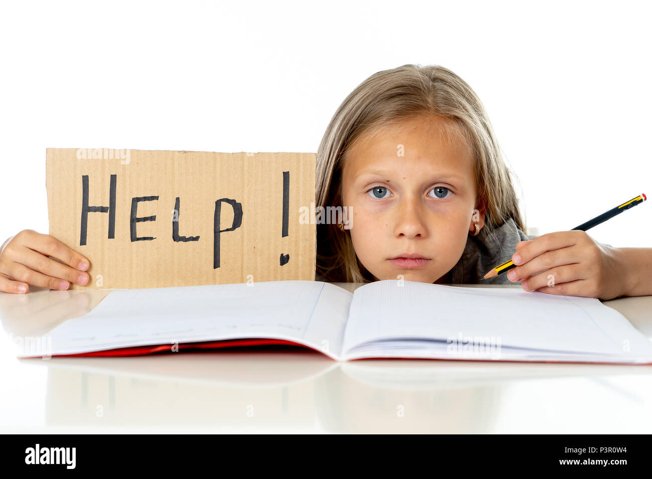 sweet cute little blonde hair school girl holding help sign in stress ...