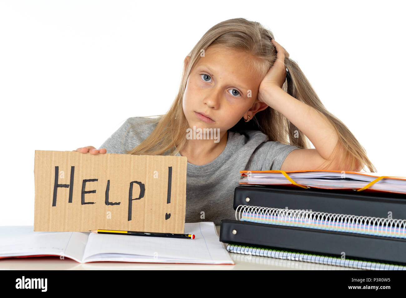 sweet cute little blonde hair school girl holding help sign in stress ...