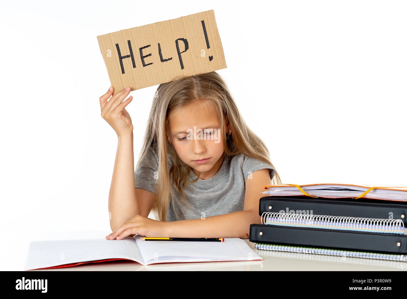 sweet cute little blonde hair school girl holding help sign in stress ...