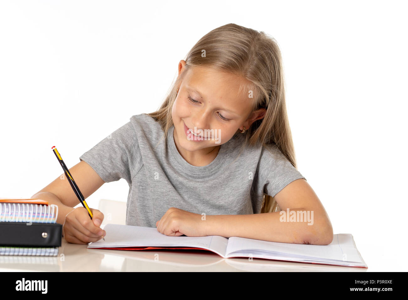 Education at home concept cute young little blonde caucasian girl studying or completing home ...
