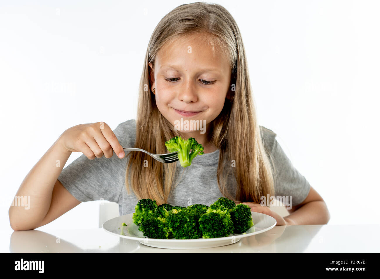 Young child broccoli happy hi-res stock photography and images - Alamy