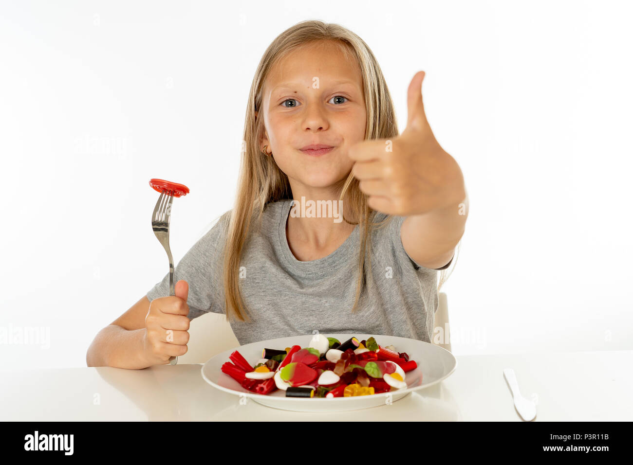 Funny happy girl with plate of candy lollipop lollies happy little girl ...