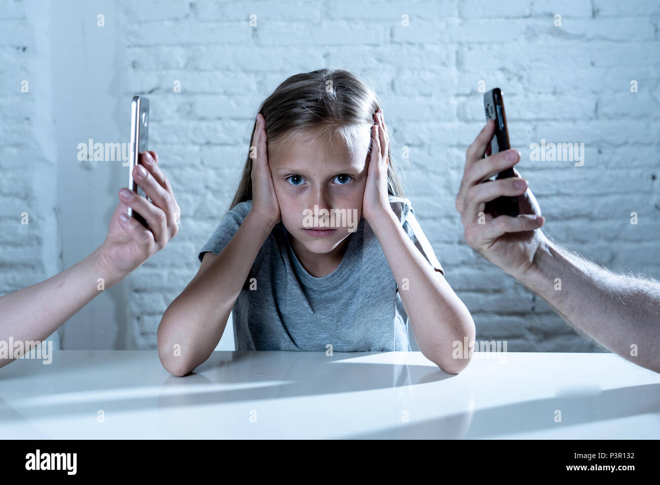 mother and father using mobile phone neglecting little sad ignored ...