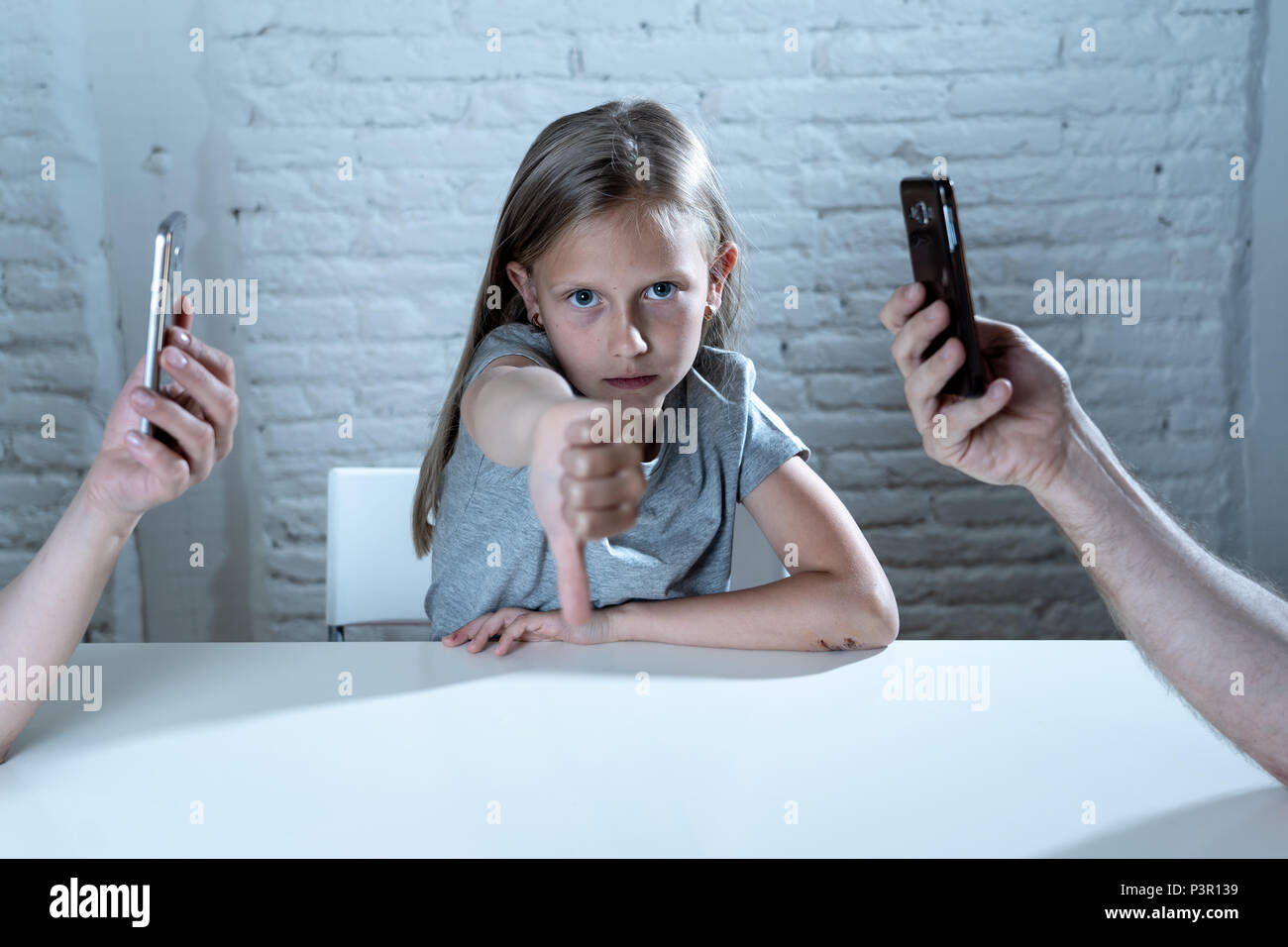 mother and father using mobile phone neglecting little sad ignored ...