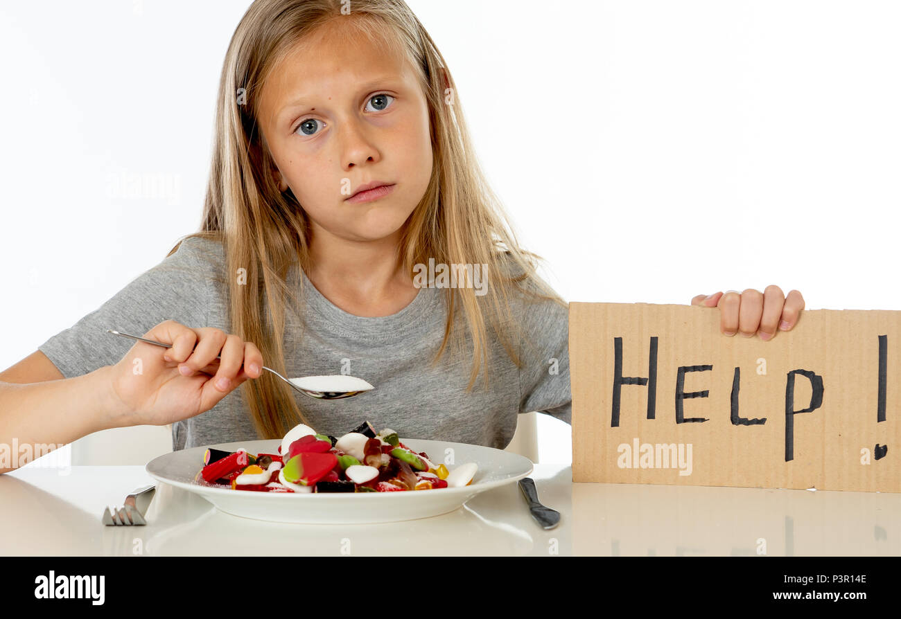 sad 8 year old female child asking for help eating dish full of candy ...
