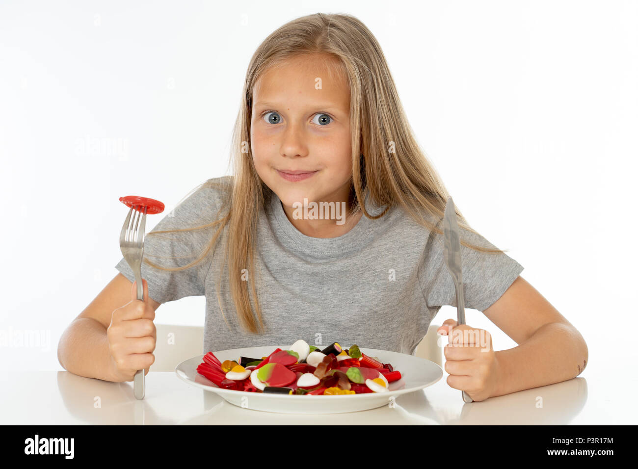 pretty happy sugar high caucasian female child eating dish full of ...
