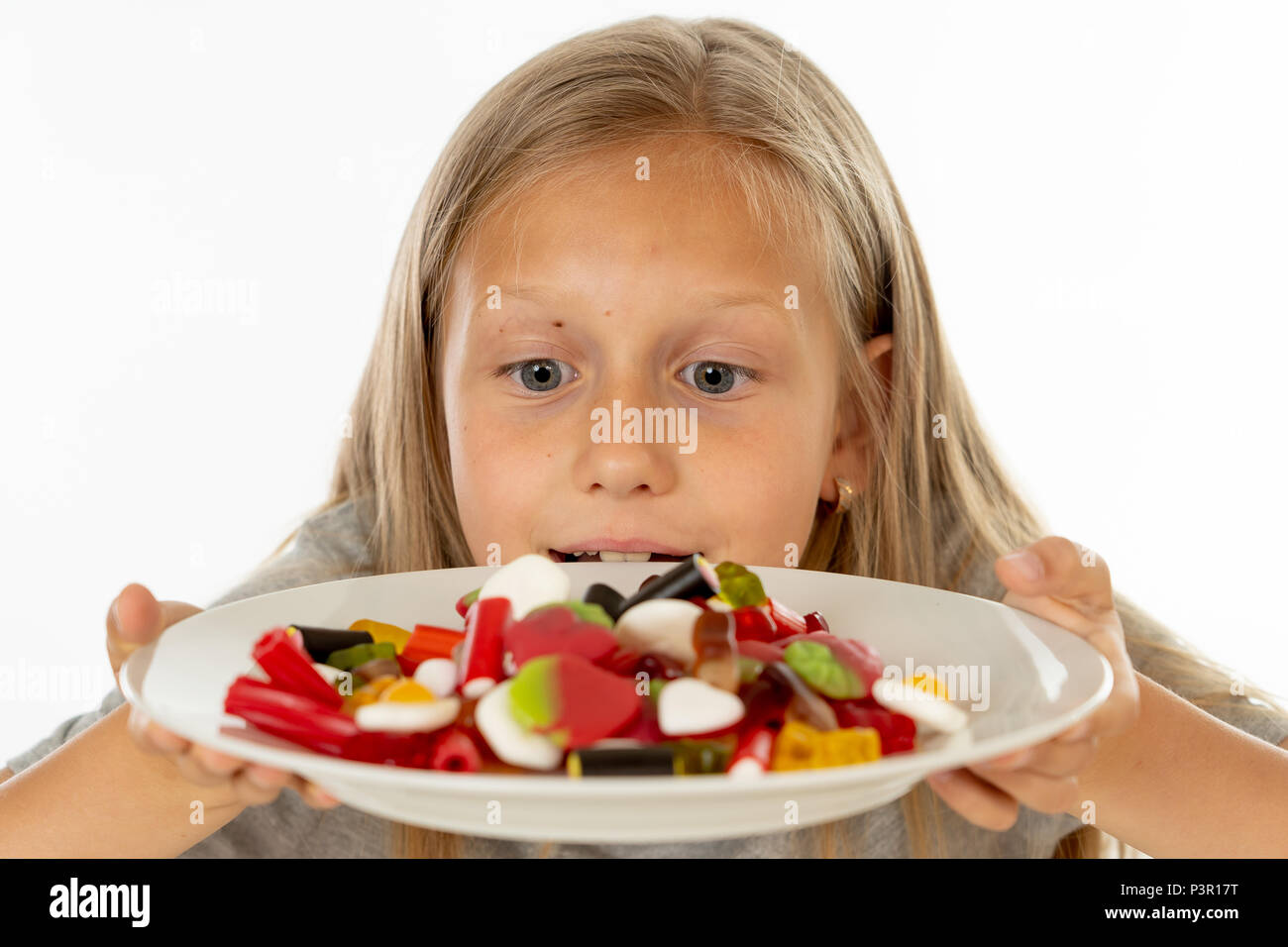 pretty happy sugar high caucasian female child eating dish full of ...