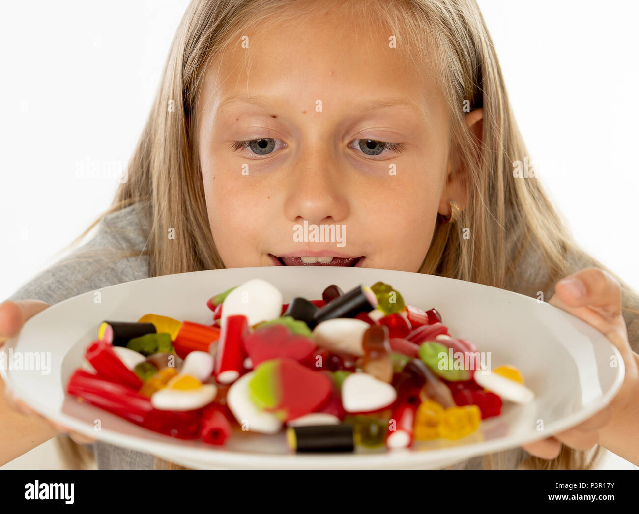 pretty happy sugar high caucasian female child eating dish full of ...