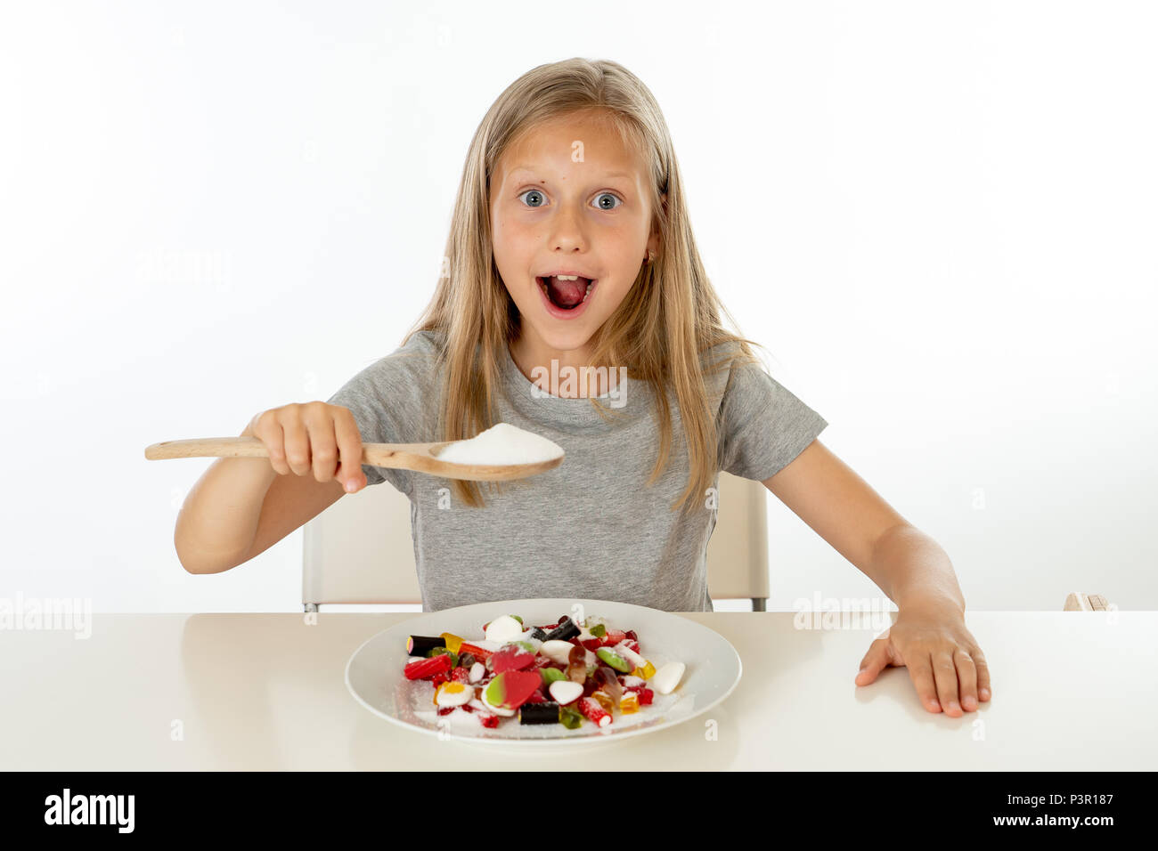 pretty happy sugar high caucasian female child eating dish full of ...