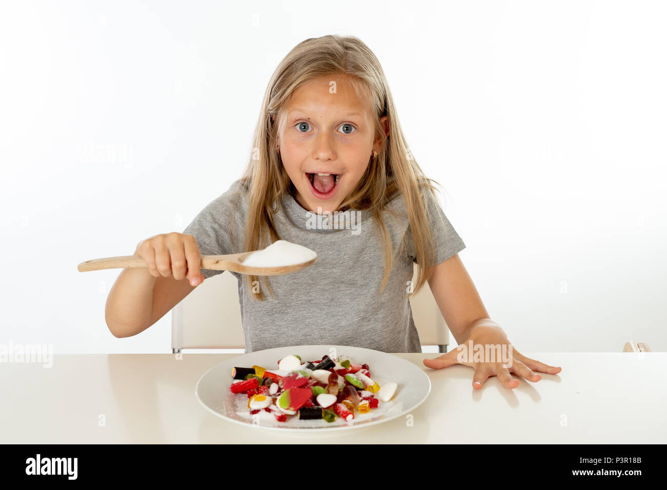 pretty happy sugar high caucasian female child eating dish full of ...