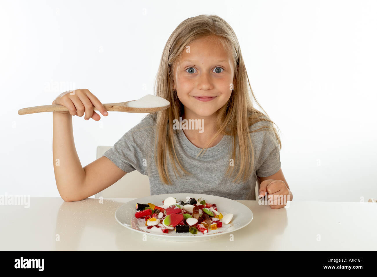pretty happy sugar high caucasian female child eating dish full of ...