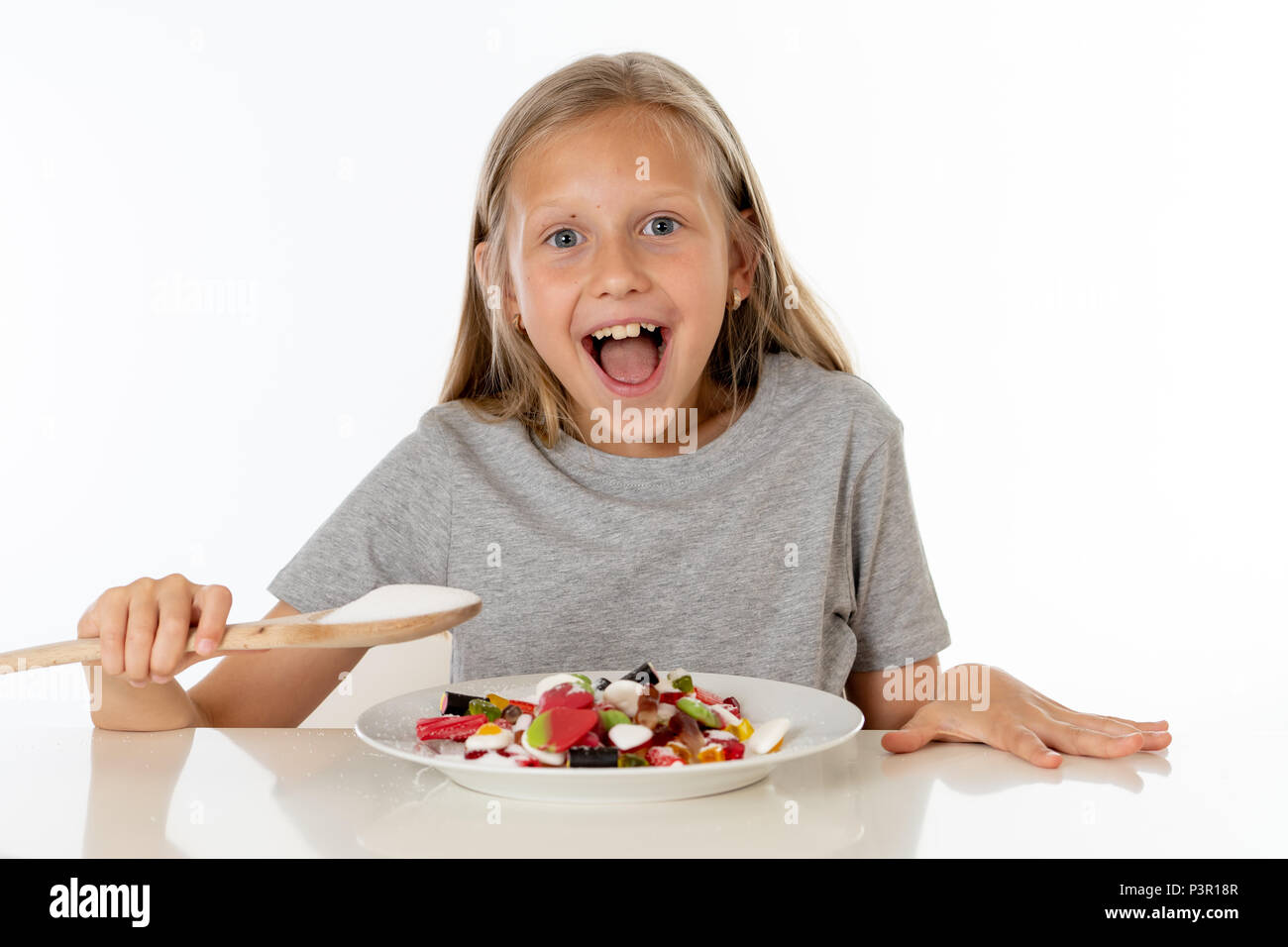 pretty happy sugar high caucasian female child eating dish full of ...