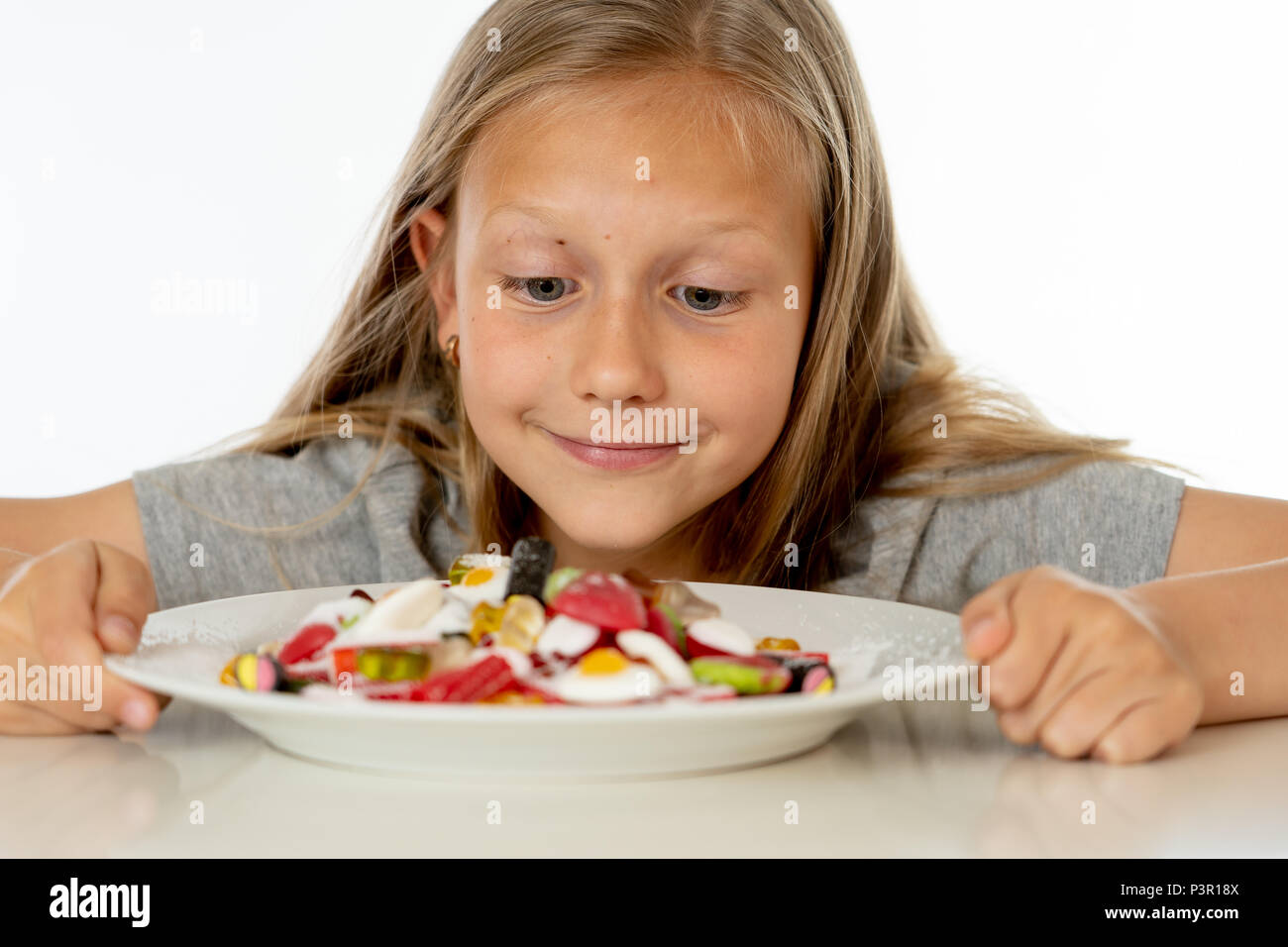 pretty happy sugar high caucasian female child eating dish full of ...