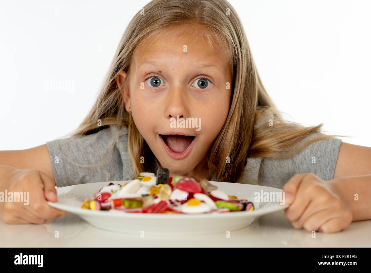 pretty happy sugar high caucasian female child eating dish full of ...