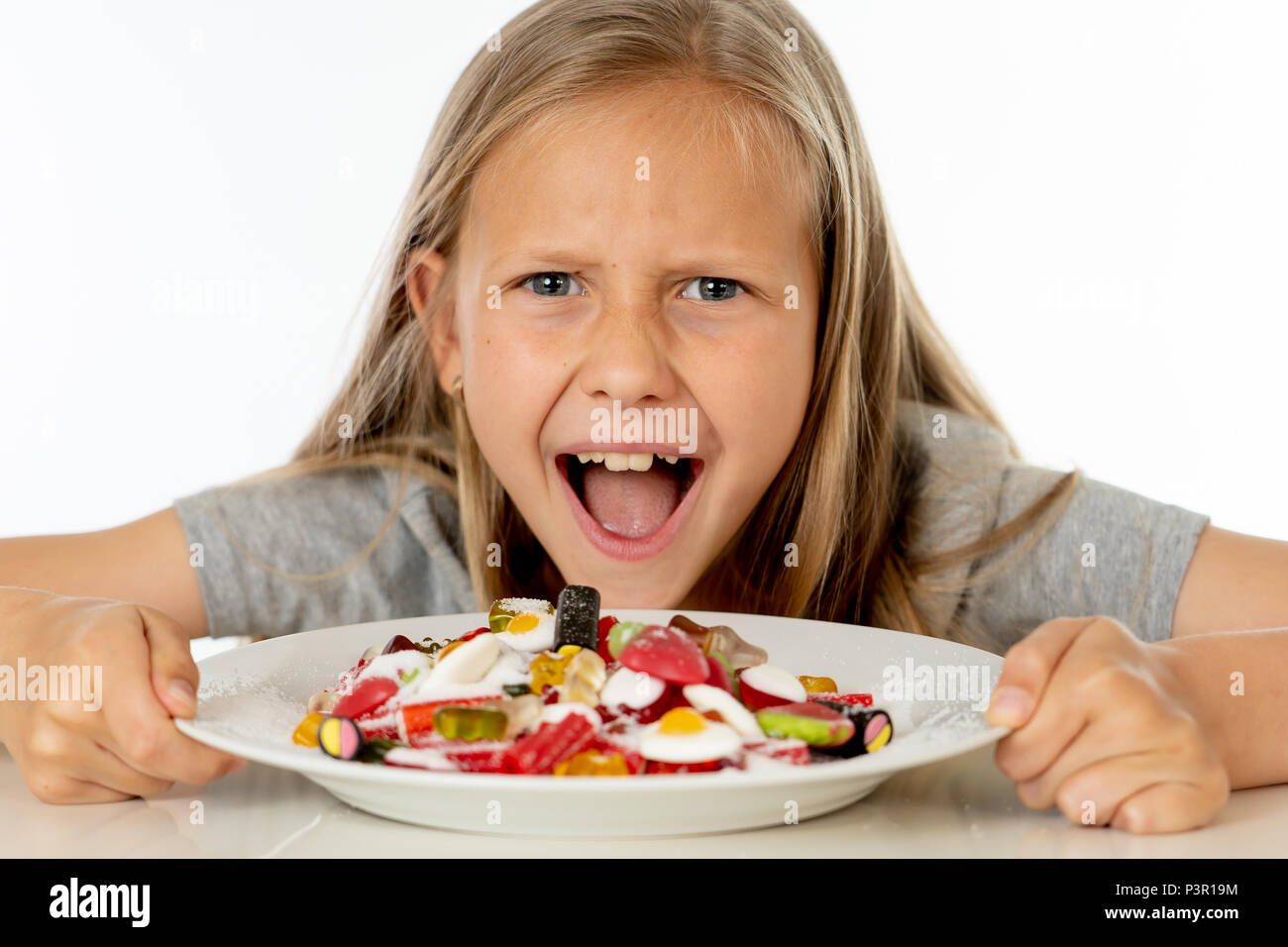 pretty happy sugar high caucasian female child eating dish full of ...