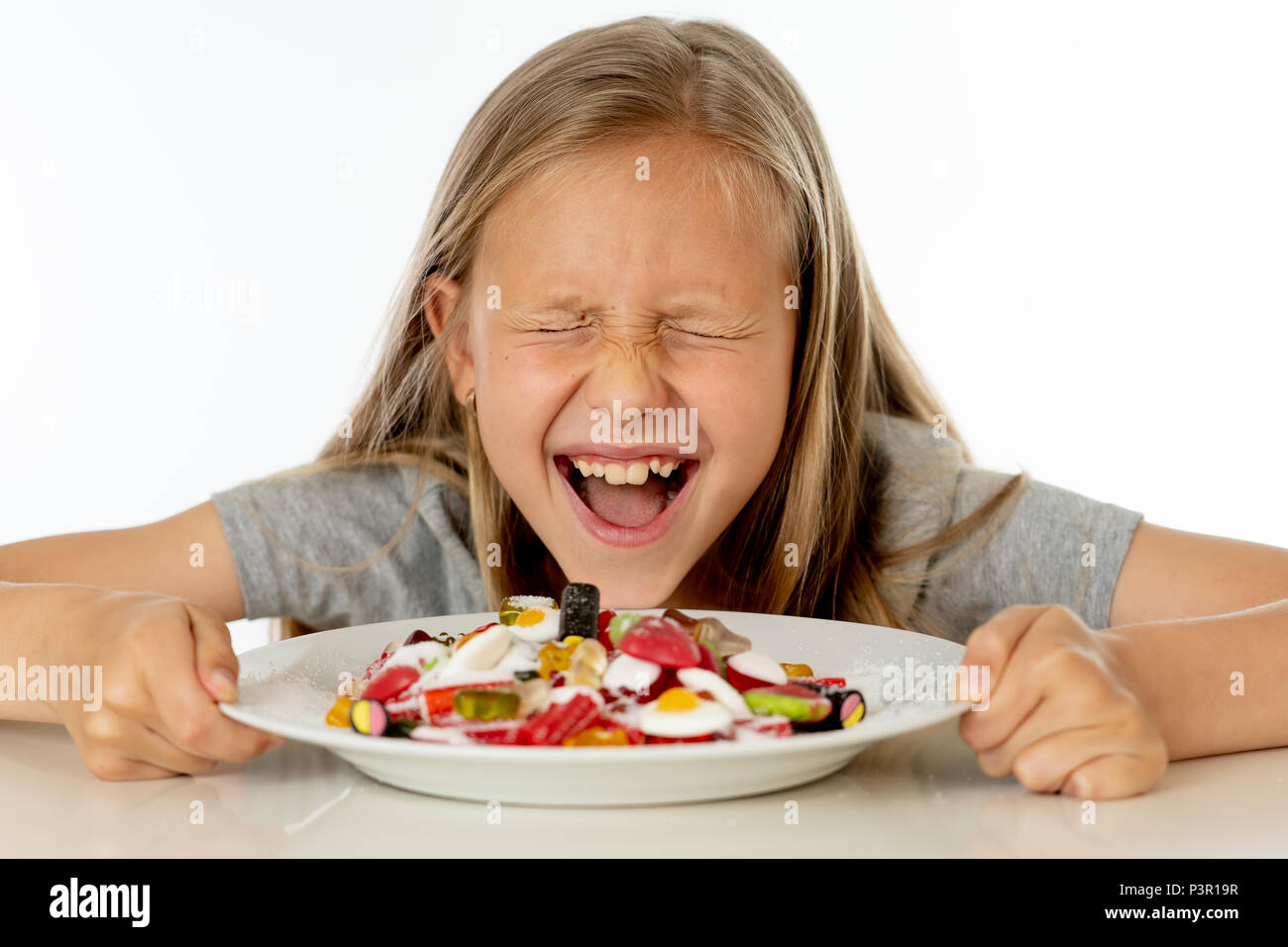 pretty happy sugar high caucasian female child eating dish full of ...